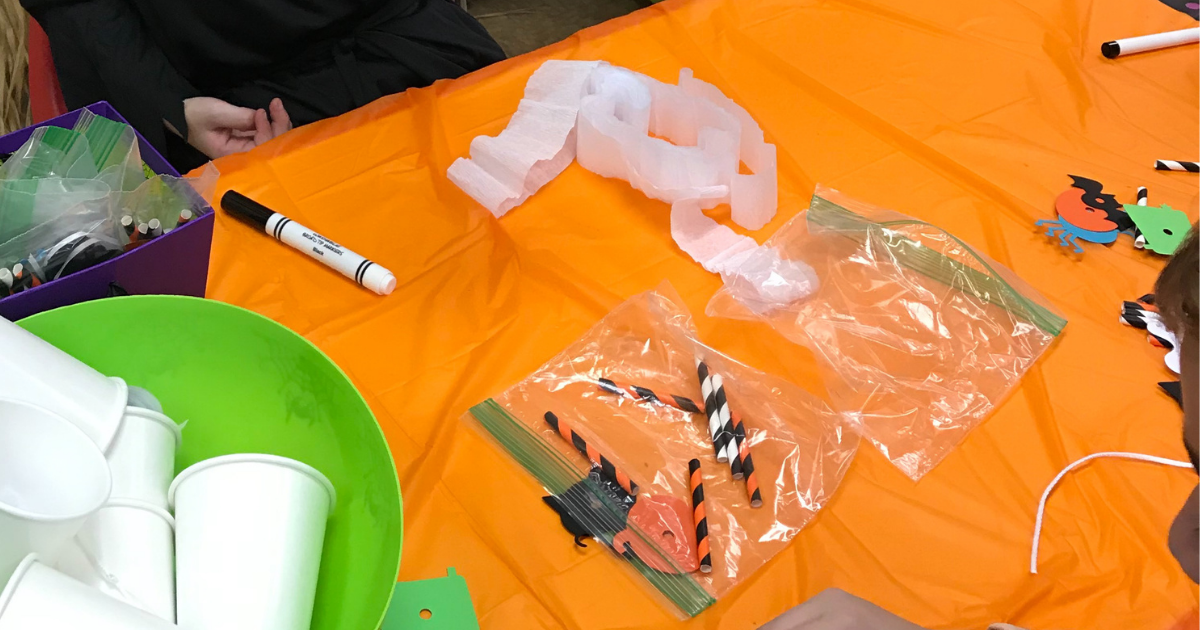 To create this easy Halloween paper straw necklace just start stringing ...