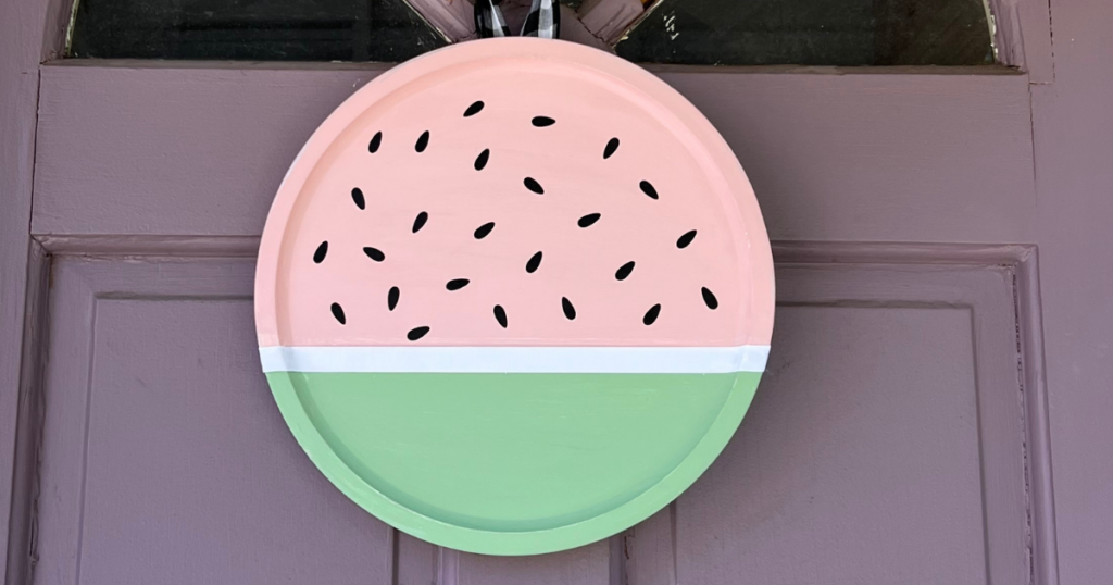 Add ribbon (with hot glue) to hang the pizza pan and your watermelon ...
